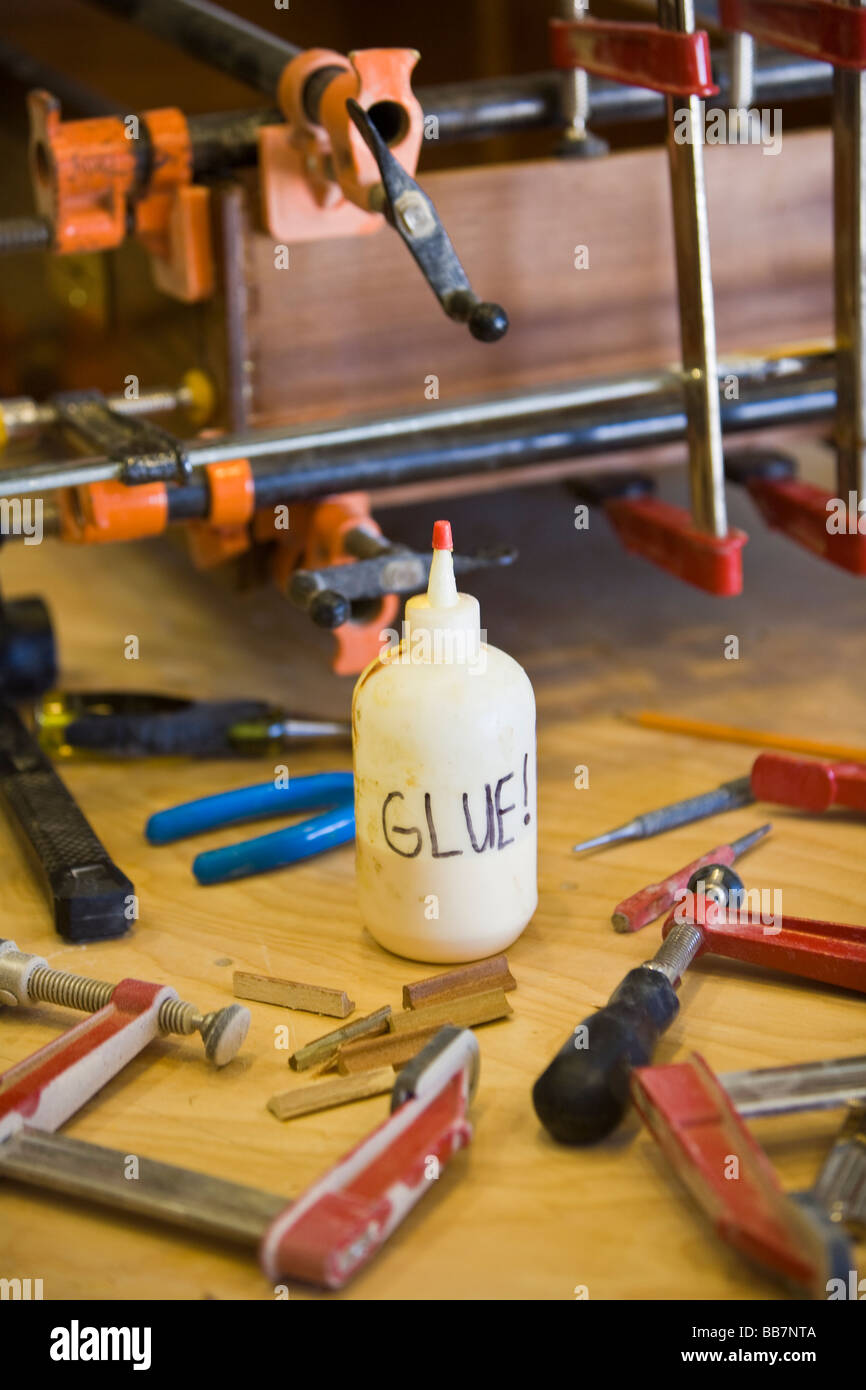 Wood working tools and glue used to repair a broken drawer Stock Photo ...