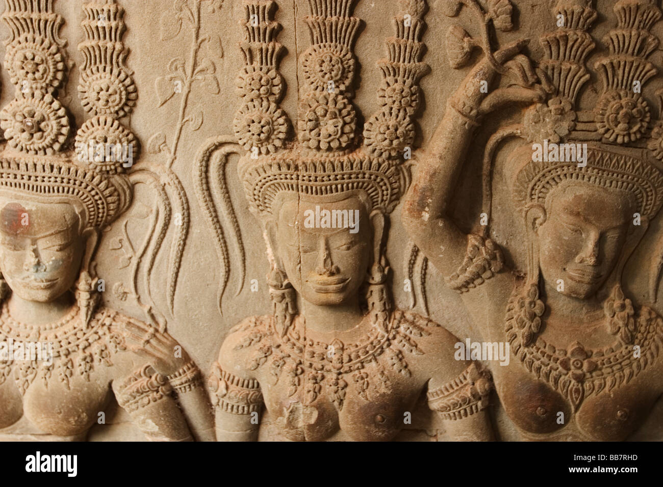 Devatas or asparas, celestial dancing girls, adorn the walls of Angkor ...