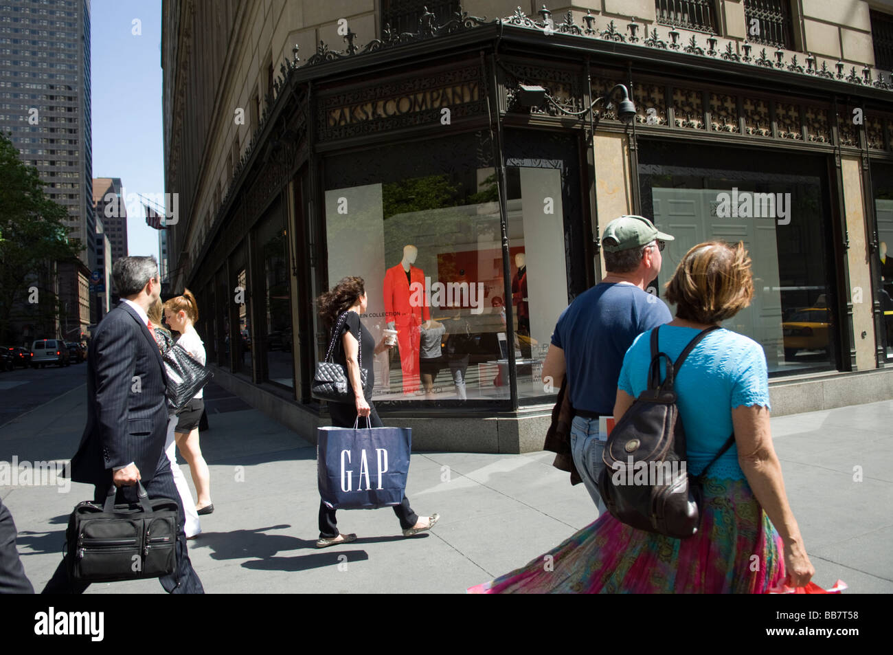 Shoppers outside of Saks Fifth Avenue in New York Stock Photo - Alamy
