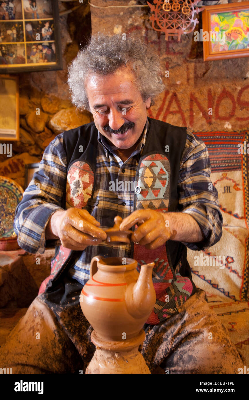Potter in Cappadocia Turkey finishing up a tea pot Stock Photo - Alamy