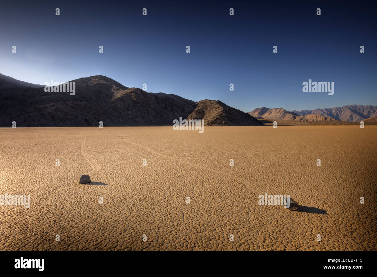 Moving rocks on salt flats at The Racetrack in Death Valley National ...