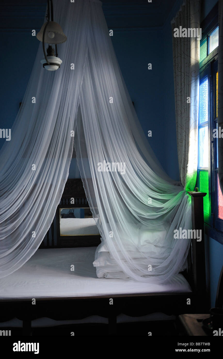 White mosquito net above the bed in a hotel Stock Photo - Alamy