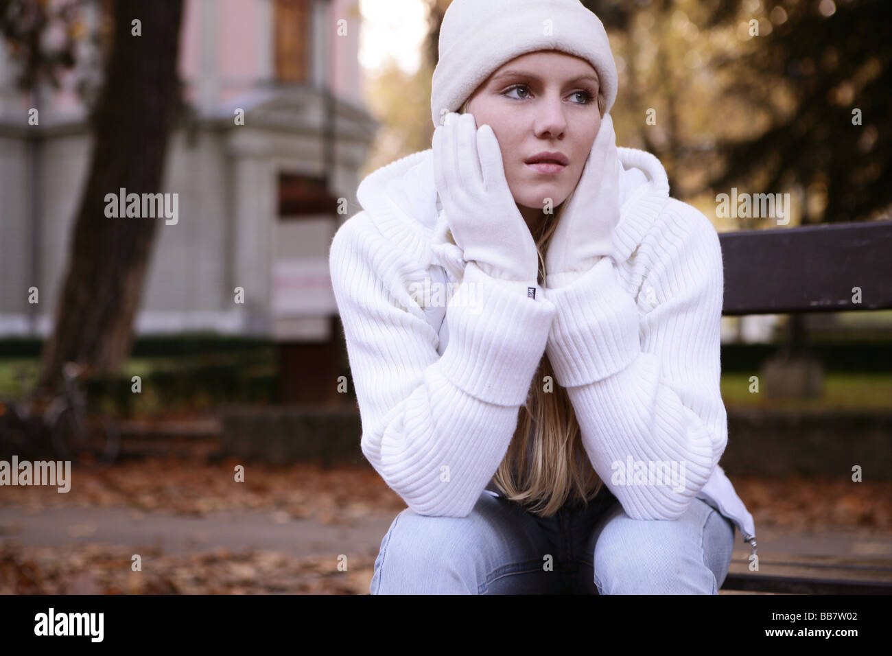 prying woman on bench in automn Stock Photo - Alamy