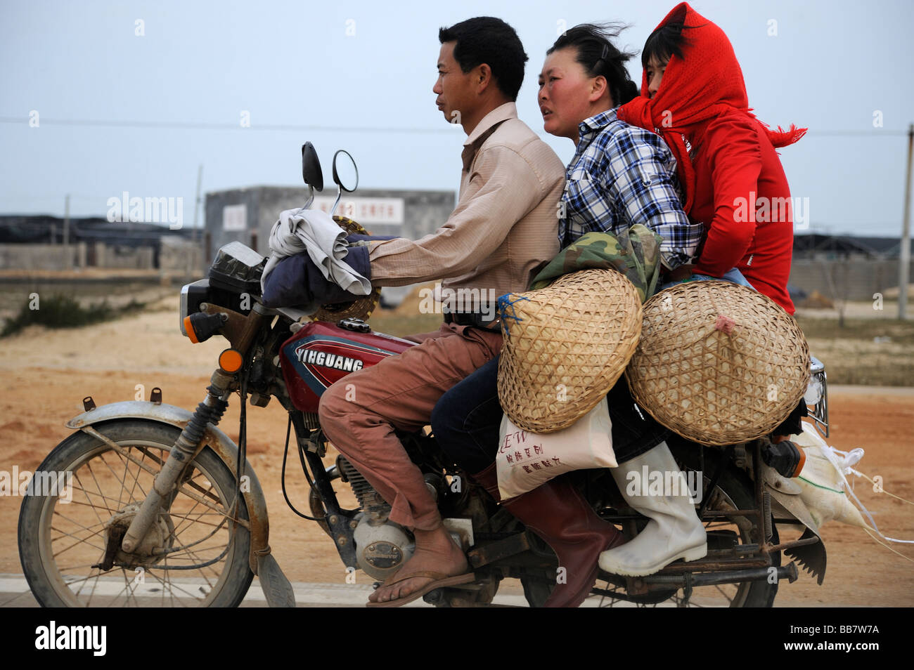 Three people on a motorcycle hi-res stock photography and images - Alamy