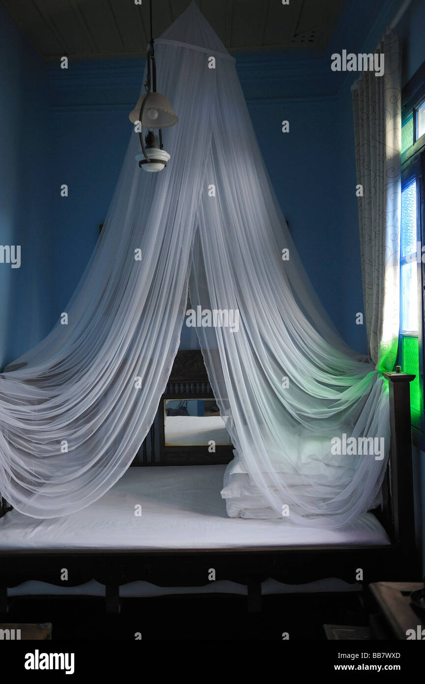 White mosquito net above the bed in a hotel Stock Photo - Alamy