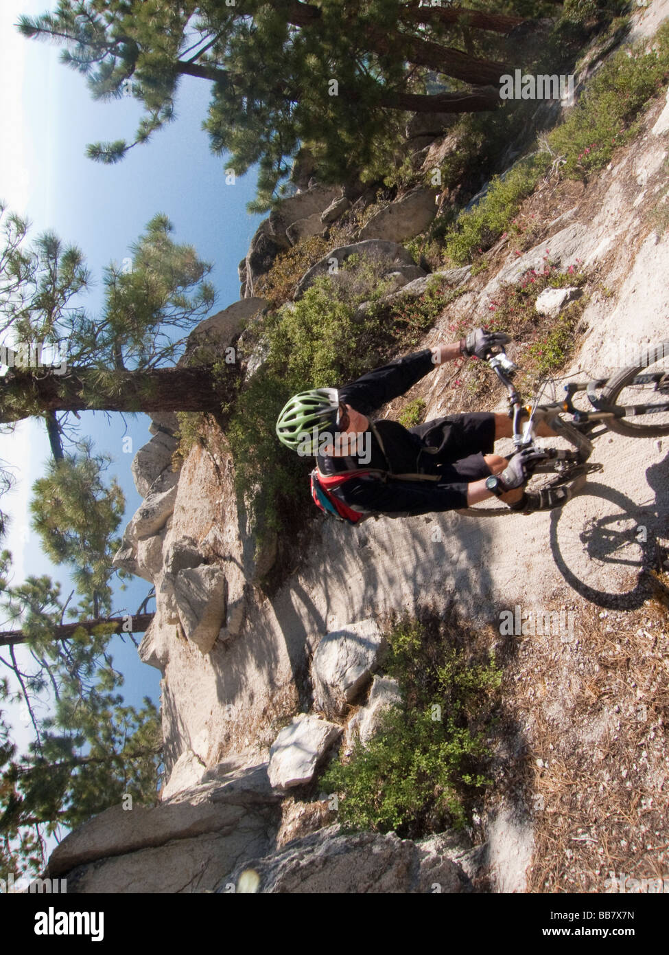 A mountain biker enjoys a view of Lake Tahoe from the Great Flume Trail ...