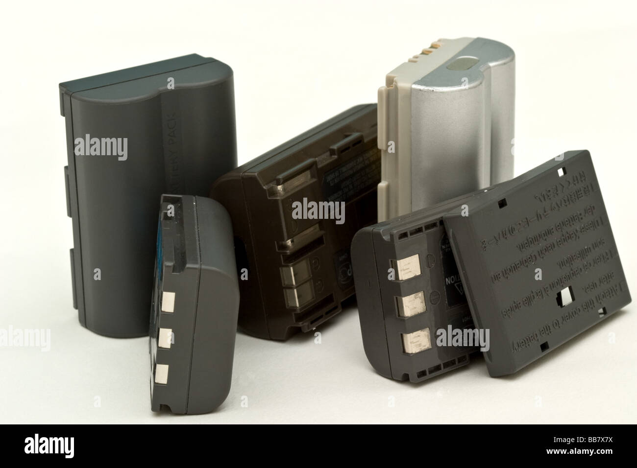 Five rechargeable digital camera batteries with a cover Stock Photo - Alamy
