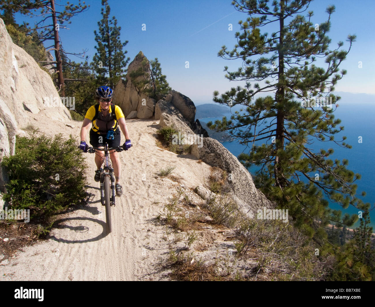 A mountain biker enjoys a view of Lake Tahoe from the Great Flume Trail ...