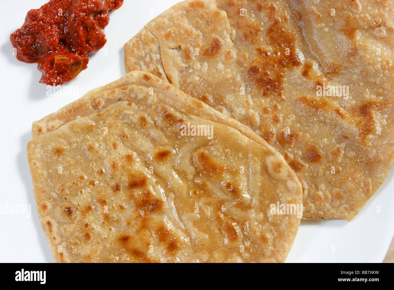 A paratha or parantha is a flatbread that originated in the Punjab ...