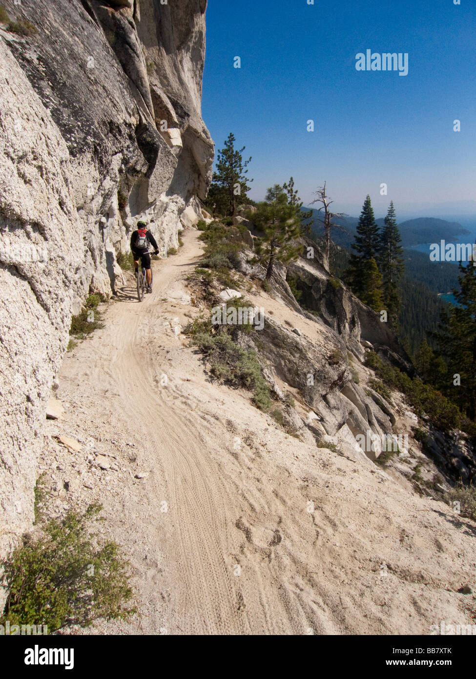 A mountain biker enjoys a view of Lake Tahoe from the Great Flume Trail ...