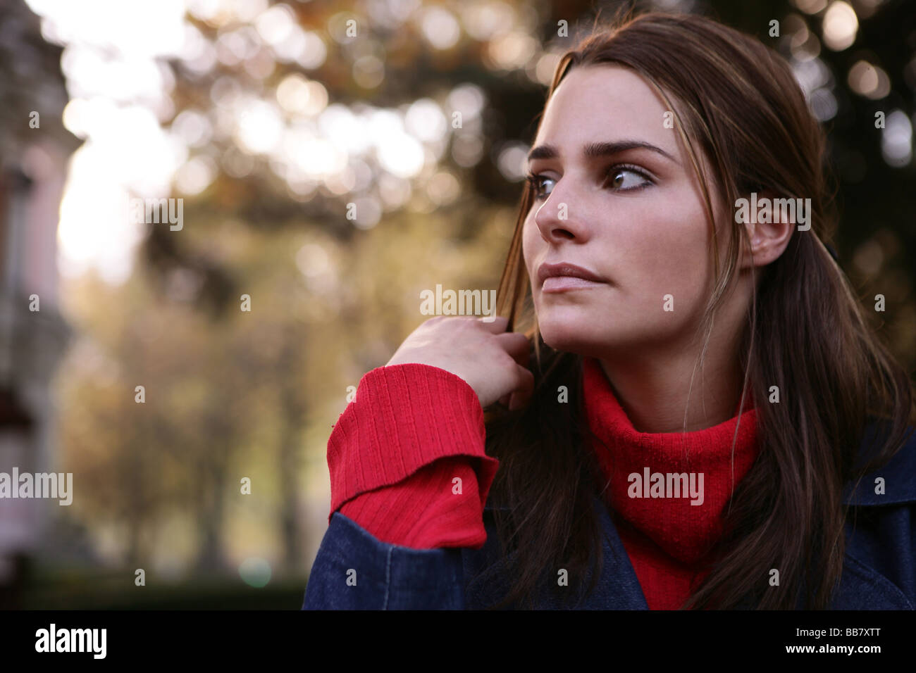 Portrait of prying woman in automn Stock Photo - Alamy