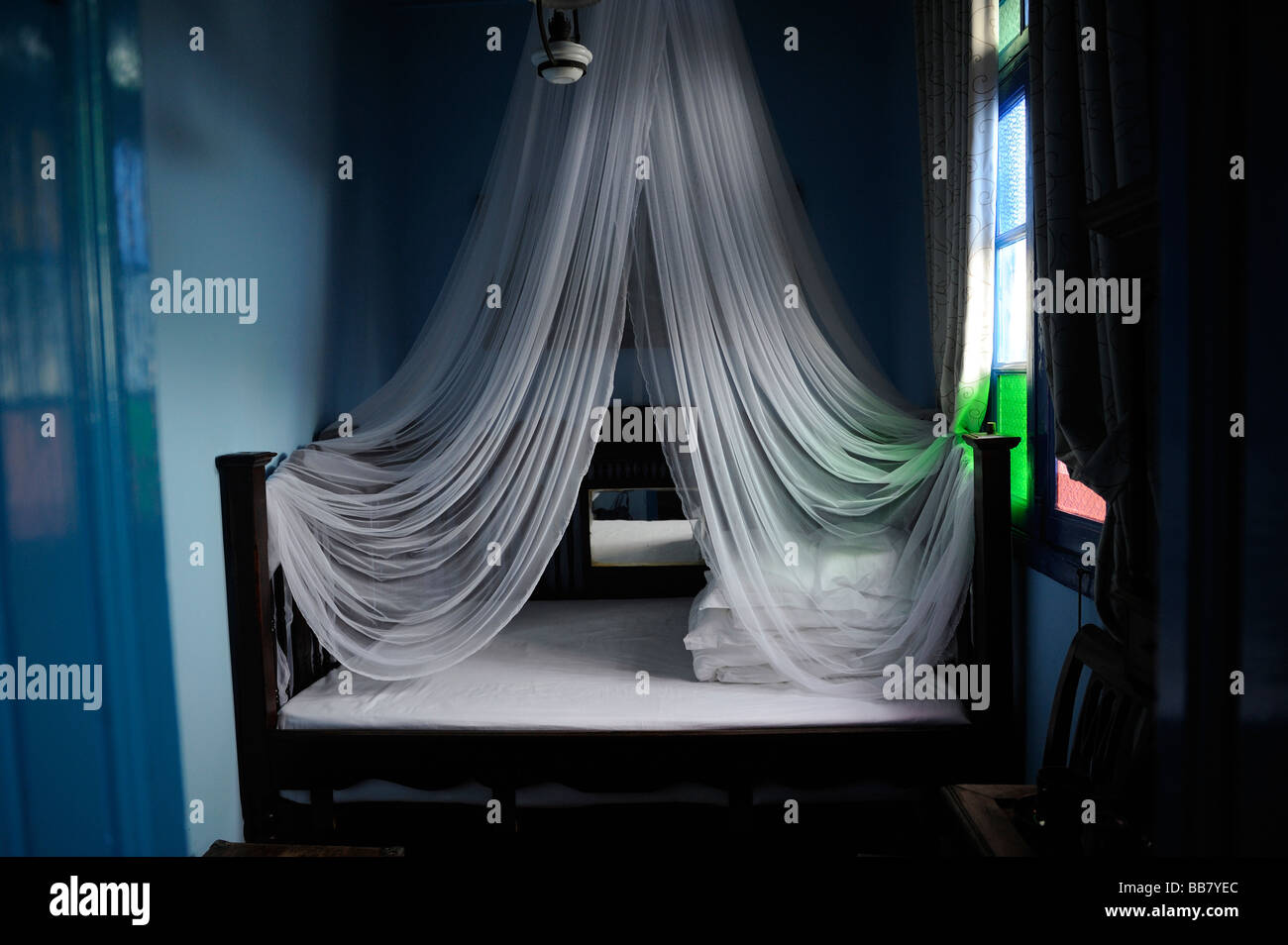 White mosquito net above the bed in a hotel Stock Photo - Alamy