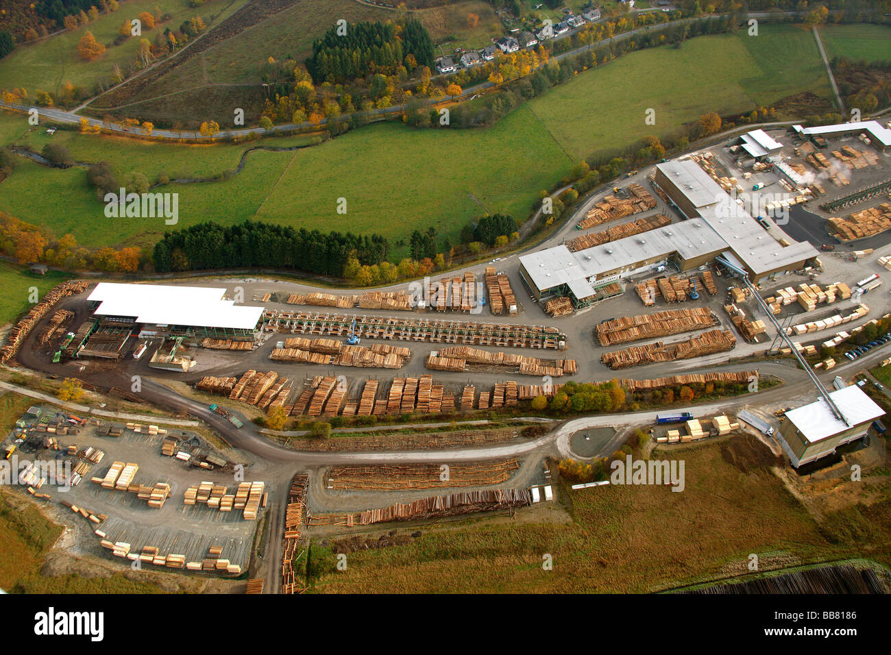 Aerial photo, lumber mill with wood cut after storm Kyrill ...
