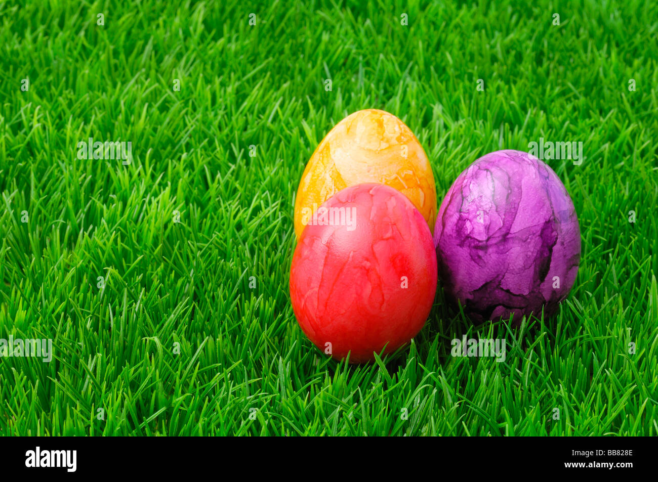 Colourful Easter eggs on grass Stock Photo - Alamy