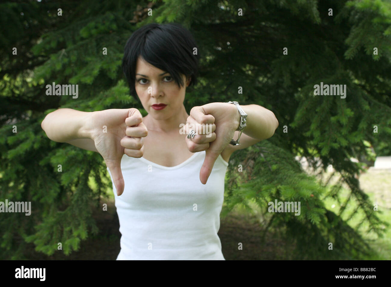 Brunette Caucasian female giving hand signals Stock Photo - Alamy