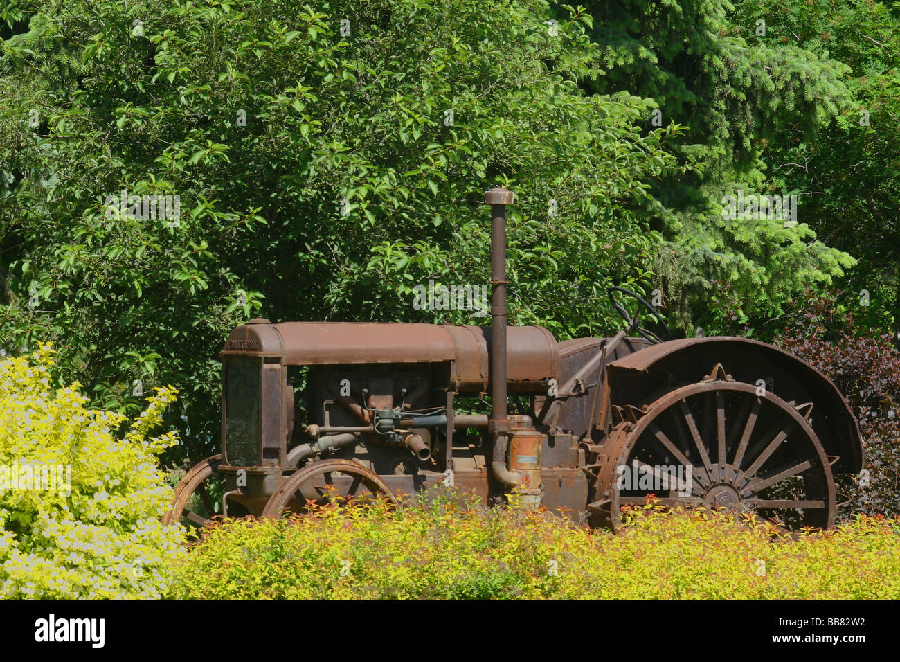 Old antique steal-wheeled tractor Stock Photo - Alamy
