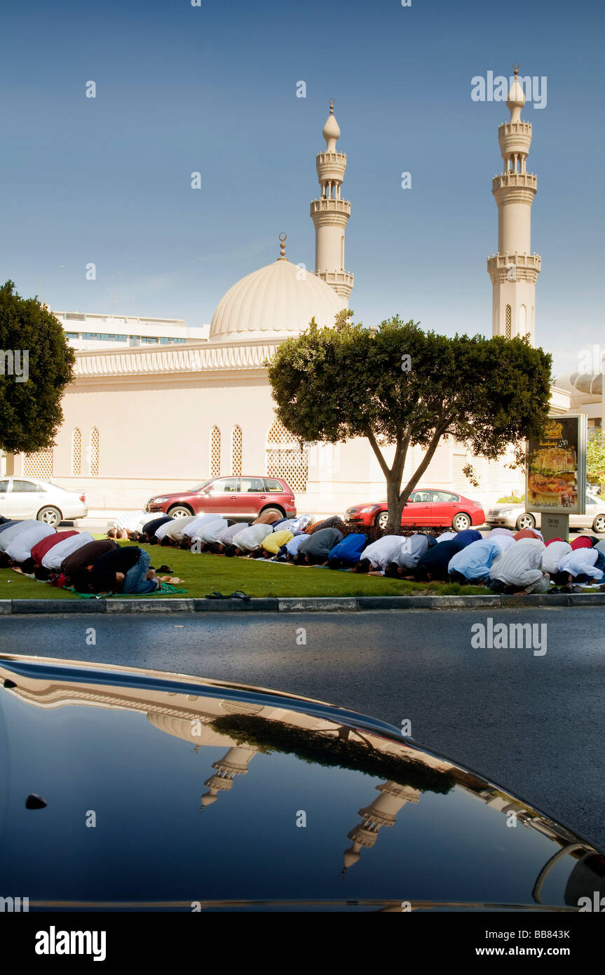 Men in front of a mosque at sunday prayer, Dubai, United Arab Emirates ...
