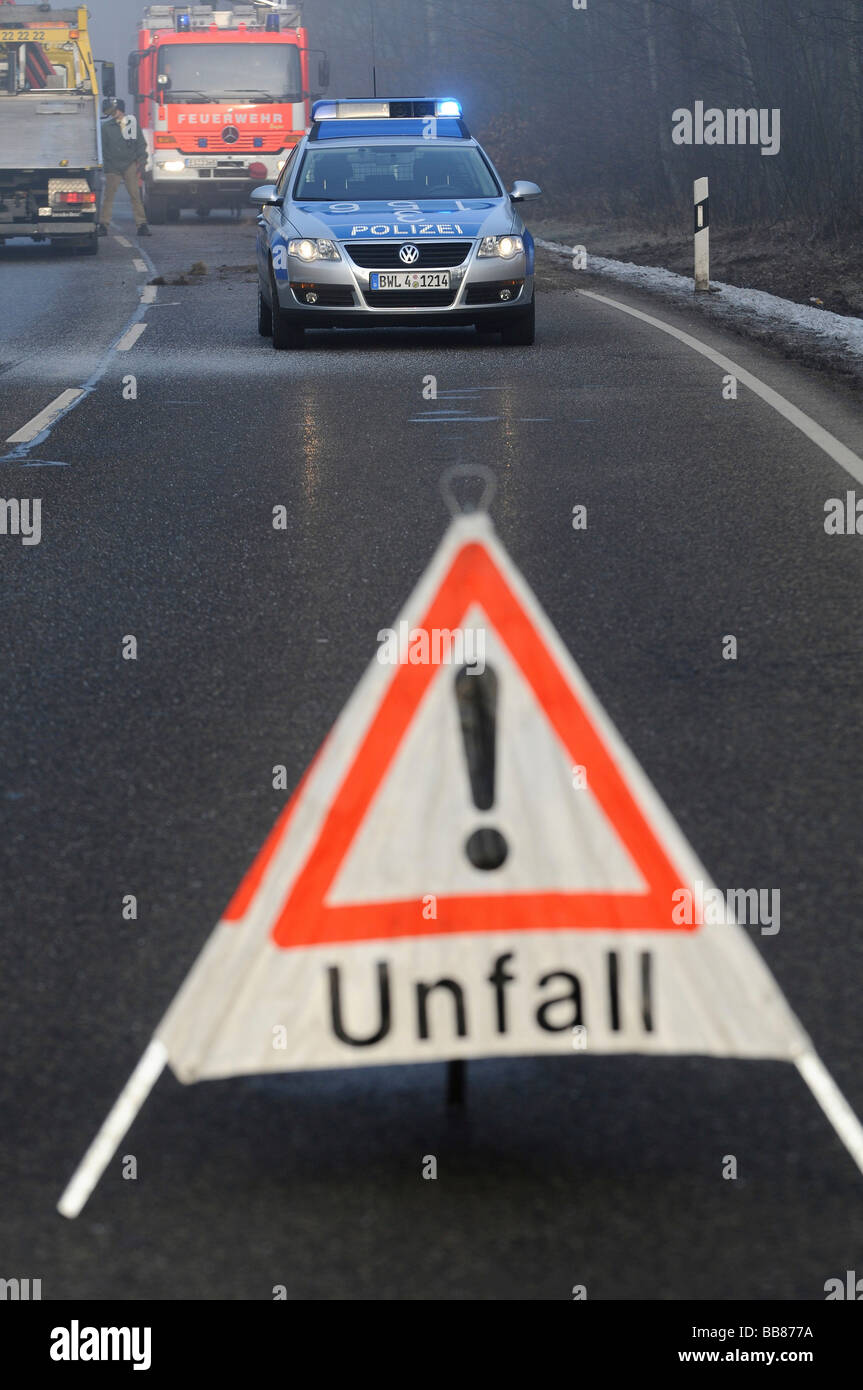Police car and warning sign, securing the accident scene after a severe ...