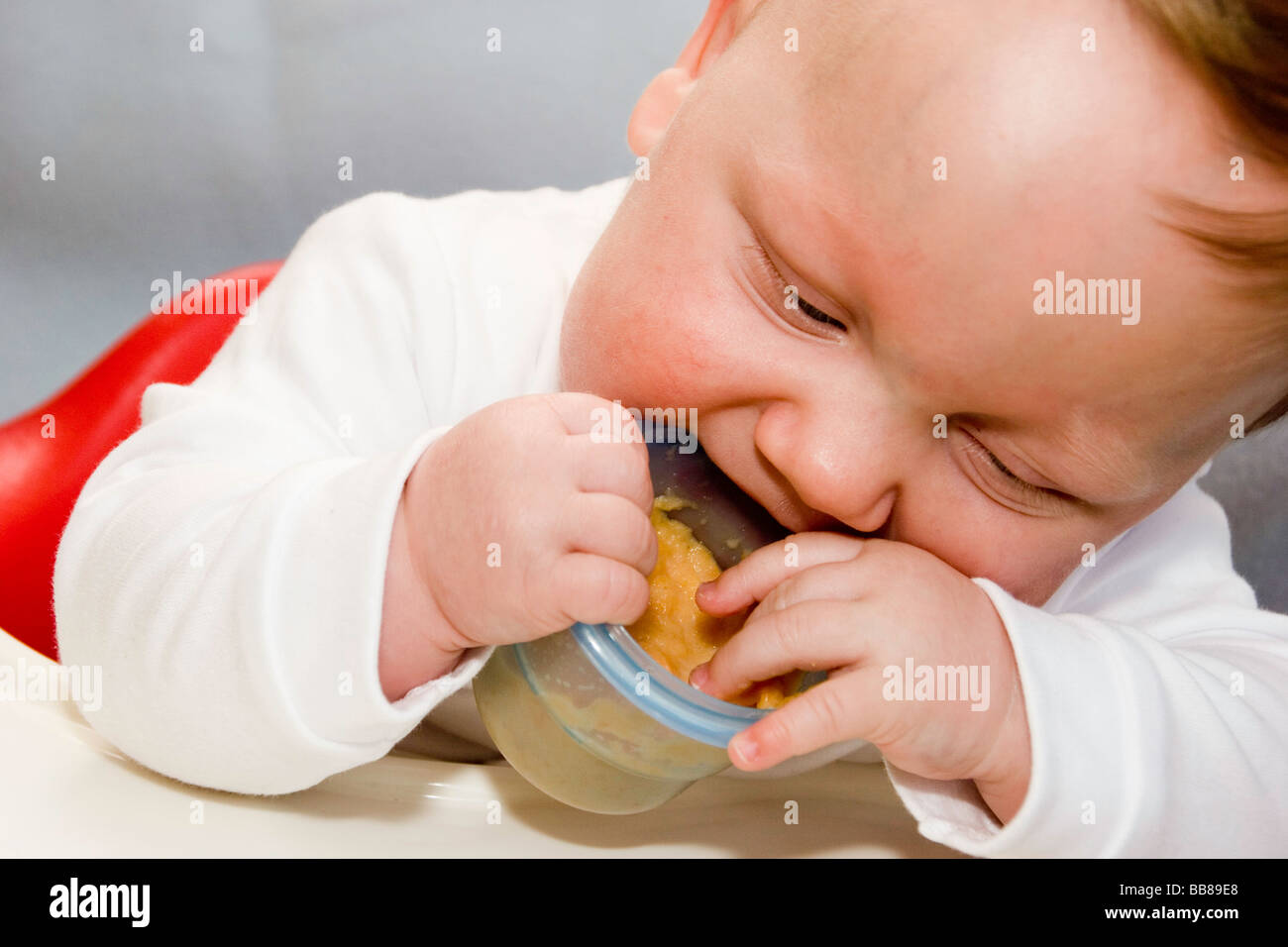 baby eating from a bowl Stock Photo - Alamy