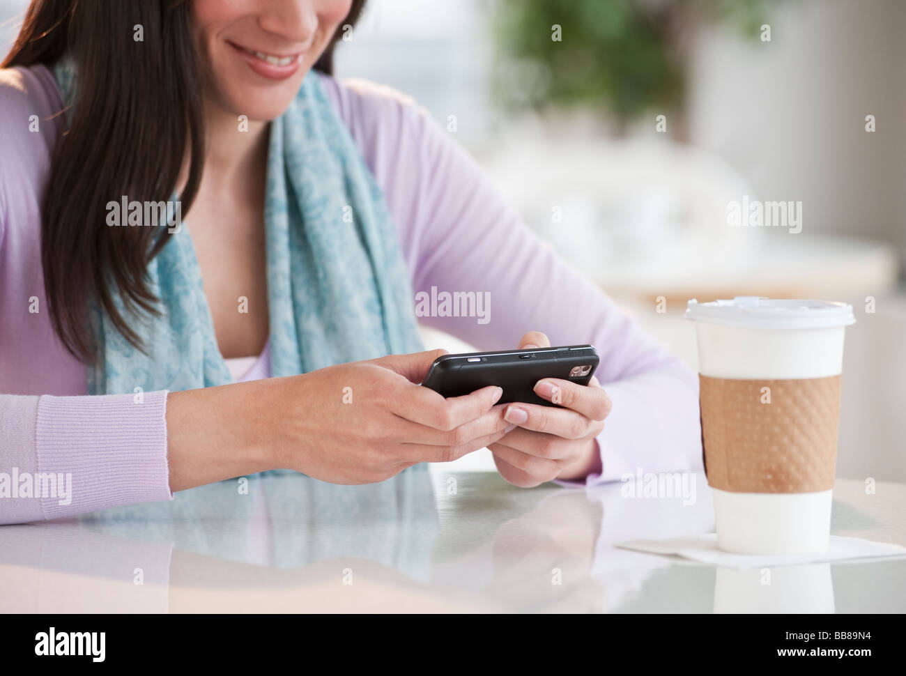 Woman text messaging Stock Photo - Alamy