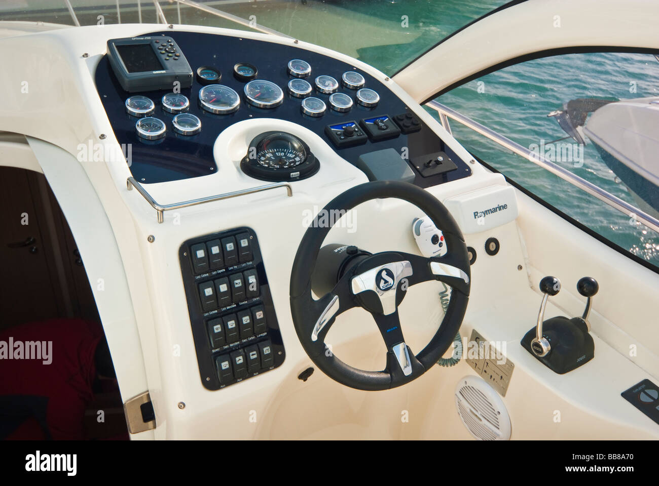 Helm and navigational instruments on a Stama 37 Powerboat Stock Photo ...