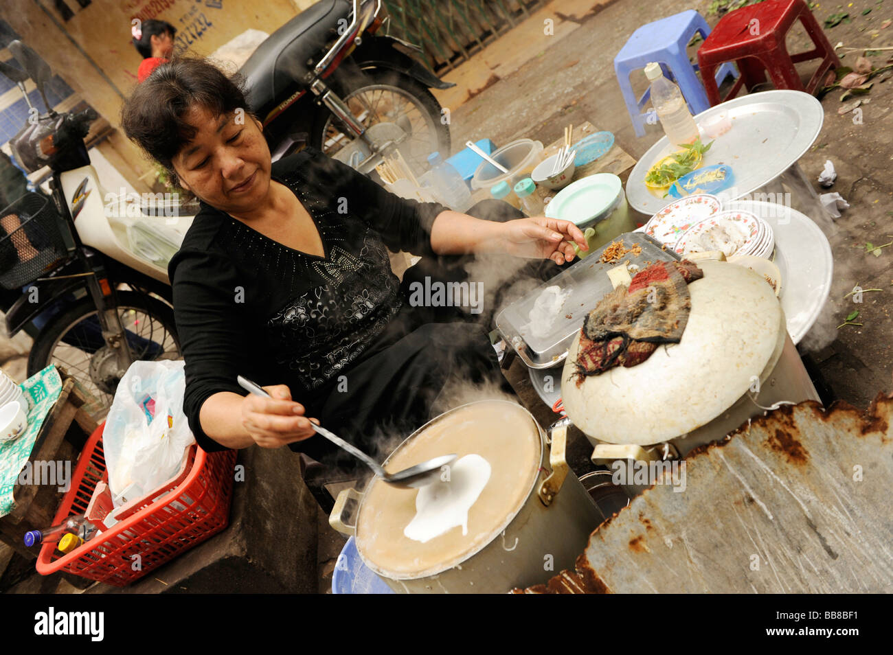 lady cooking Vietnamese crepes traditional vietnamese food eat with hot ...