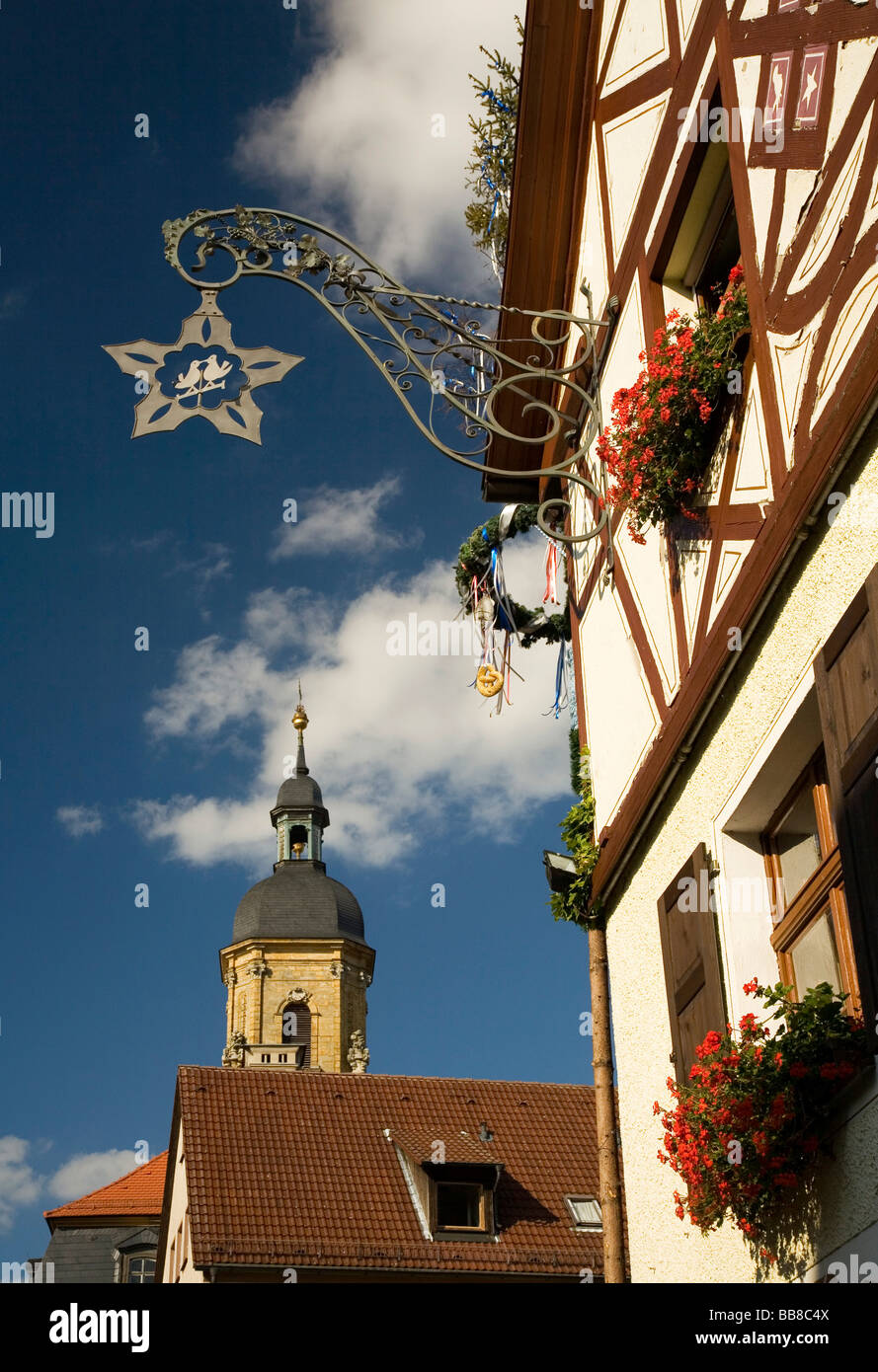 Guild sign on a hotel and the Basilica in Goessweinstein, Franconian ...