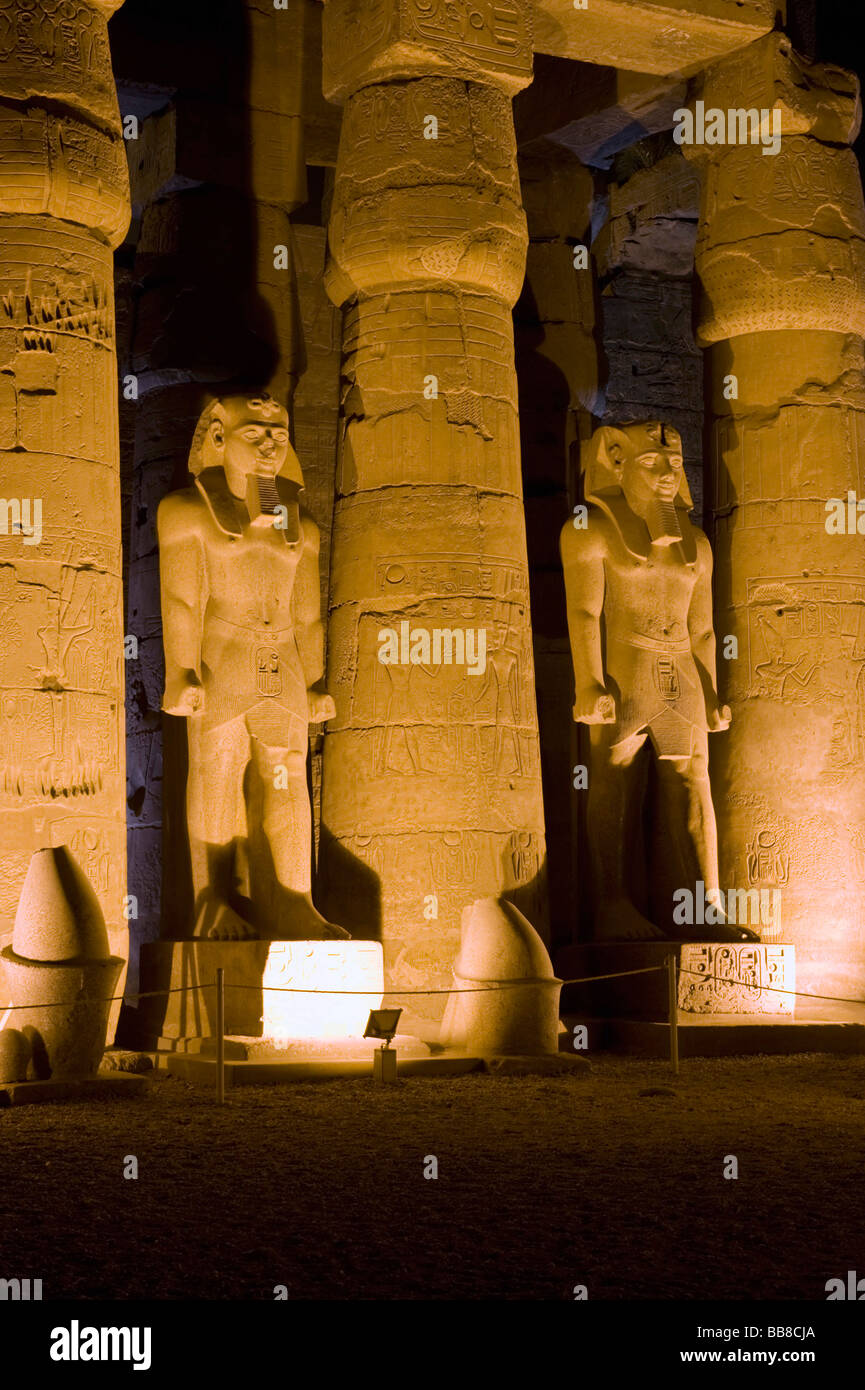 Two illuminated statues of Ramesses II, first inner courtyard, Luxor ...