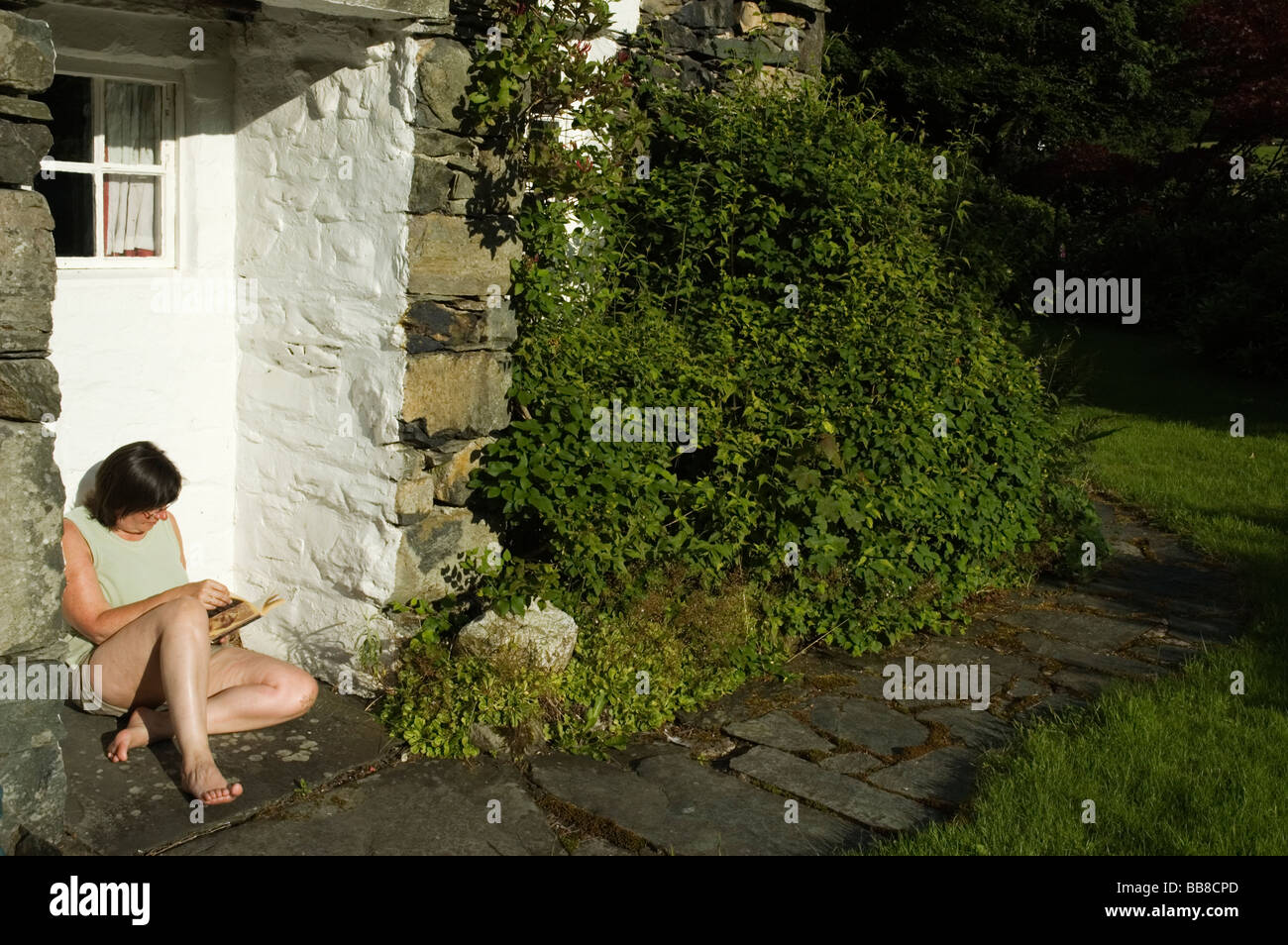 Woman in lake cottage hi-res stock photography and images - Alamy