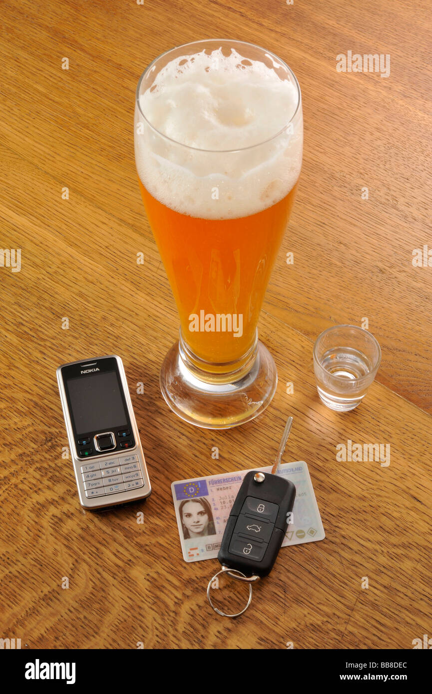 Wheat beer, car keys, symbolic of drink-driving Stock Photo - Alamy