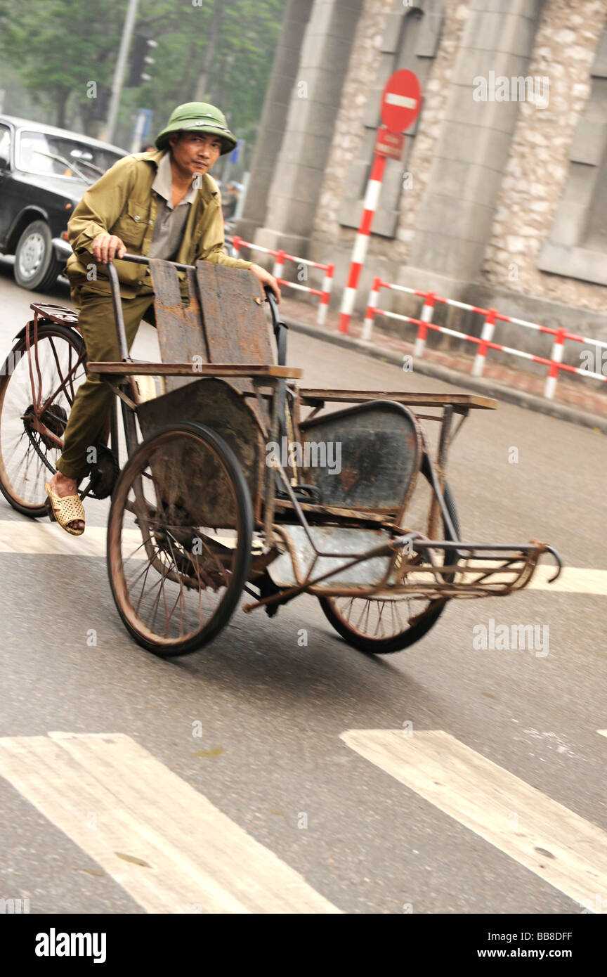 Vietnamese man with old cycle riding in Old Quarter, Hanoi, vietnam ...