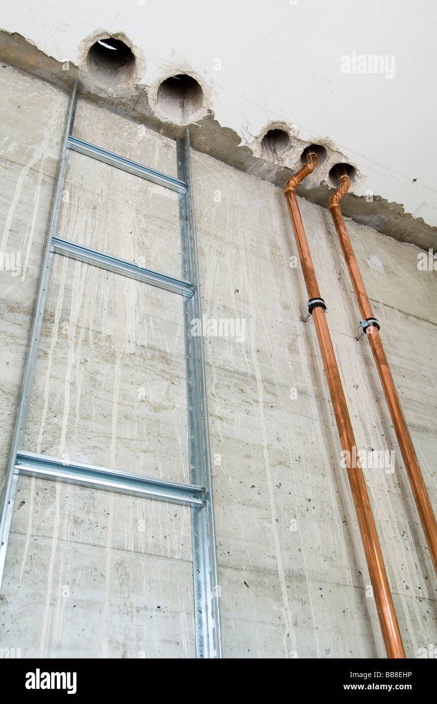 Coring drill holes in concrete for supply lines in a new building Stock ...