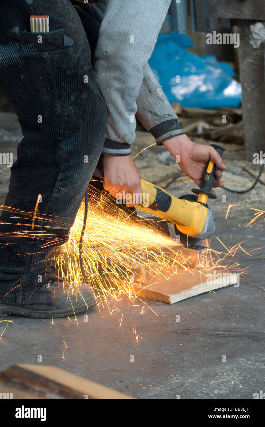 Cutting and grinding work with flying sparks Stock Photo - Alamy