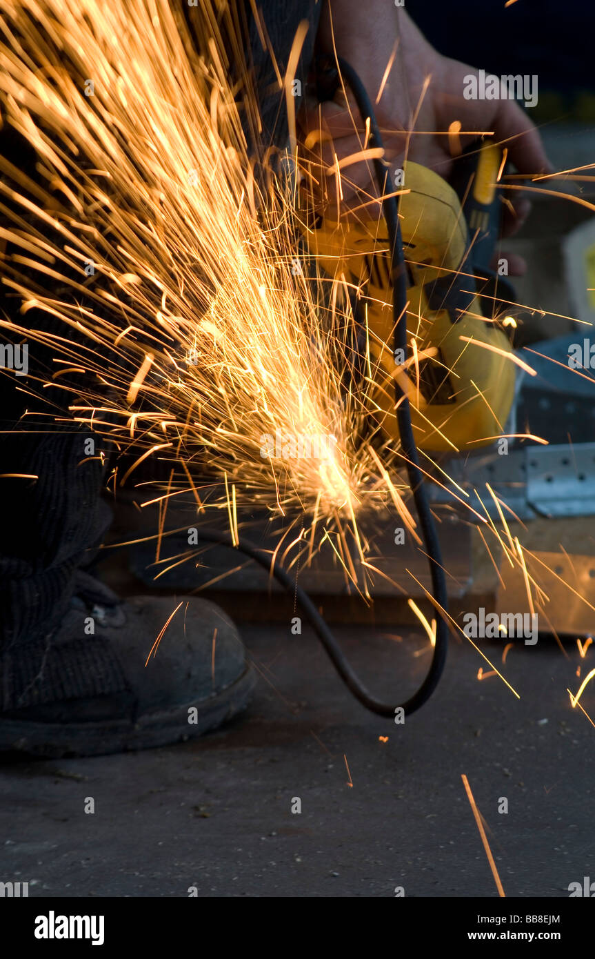 Cutting and grinding work with flying sparks Stock Photo - Alamy