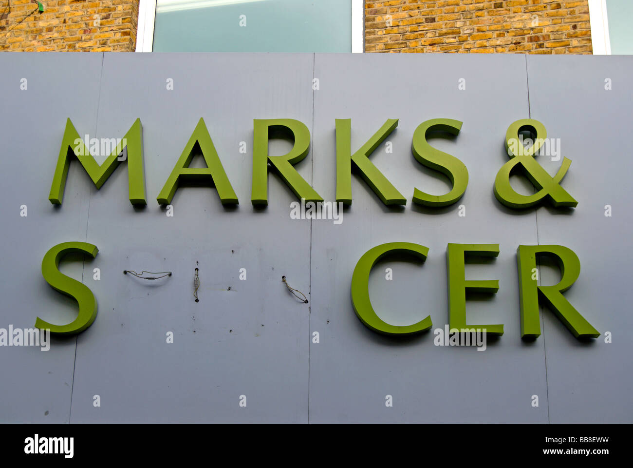 sign for marks and spencer store with missing letters Stock Photo - Alamy