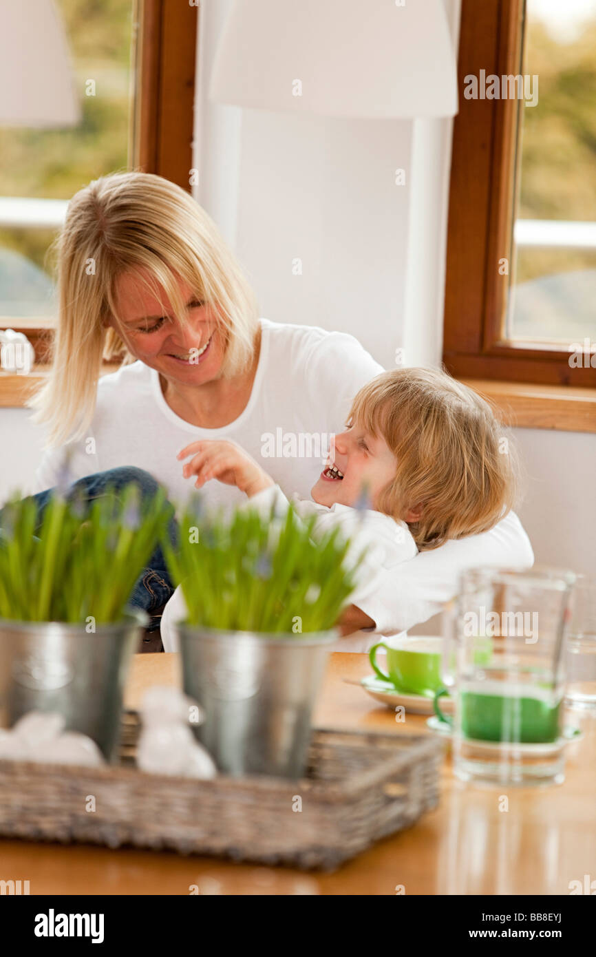 Mother tickling her 3-years-old son Stock Photo - Alamy