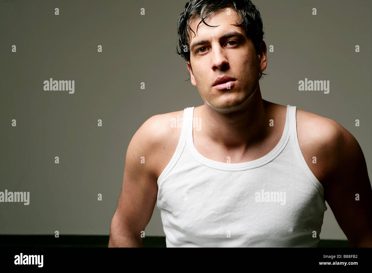 Portrait of man wearing tank top Stock Photo - Alamy