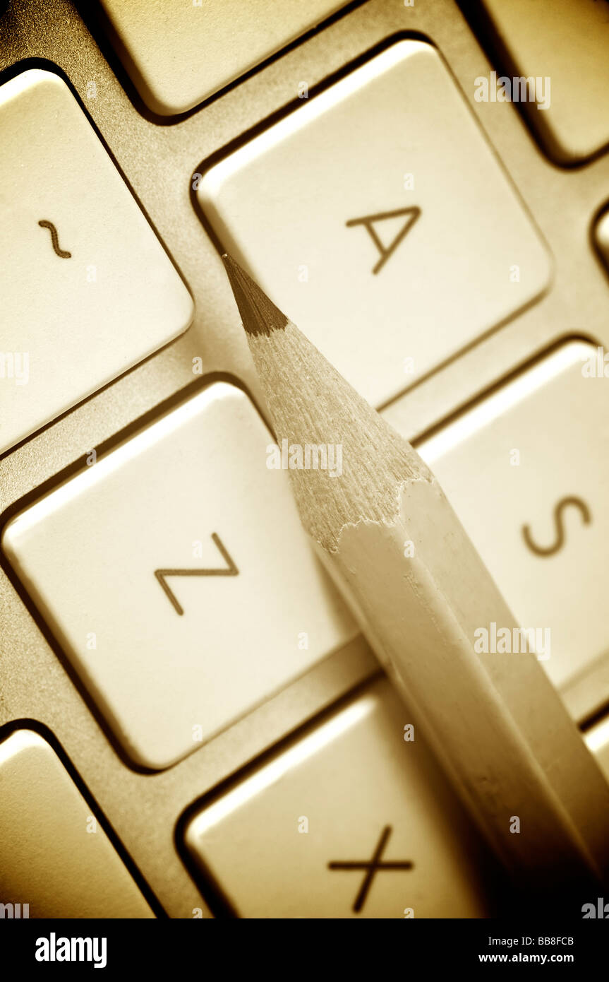 Computer keyboard and pencil Stock Photo - Alamy