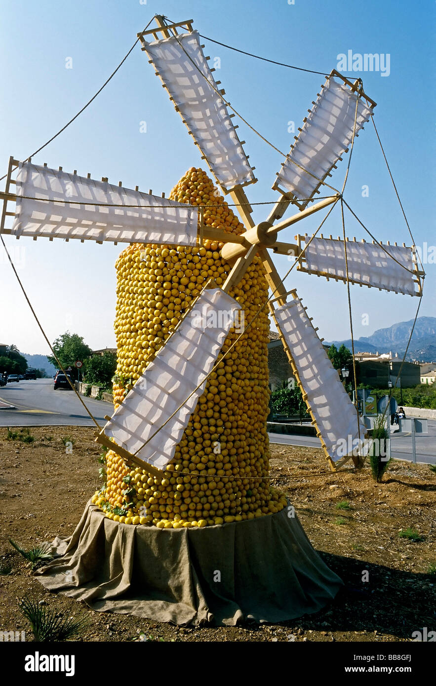 Windmill made of citrus fruit erected on the edge of a beach, Orange ...