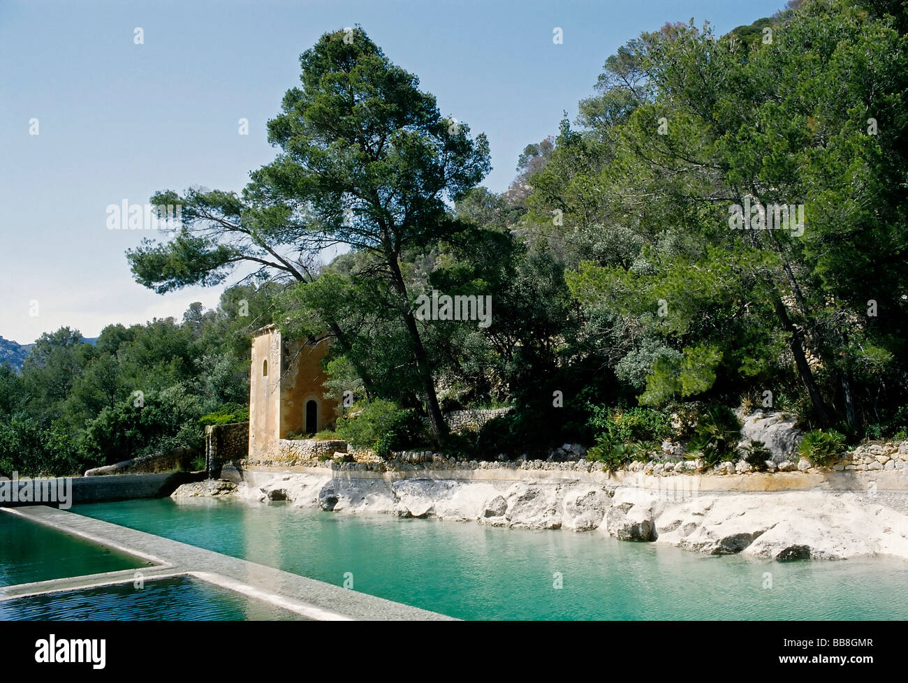 La Raixa Gardens, water basins with an old tower, near Bunyola, Serra ...