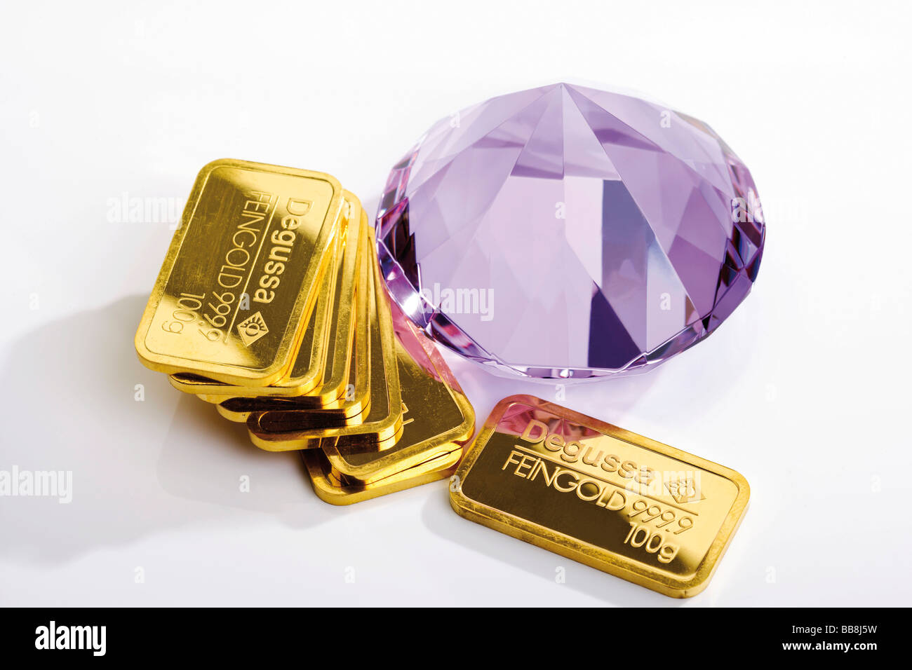 Pile of gold bars with a diamond Stock Photo - Alamy