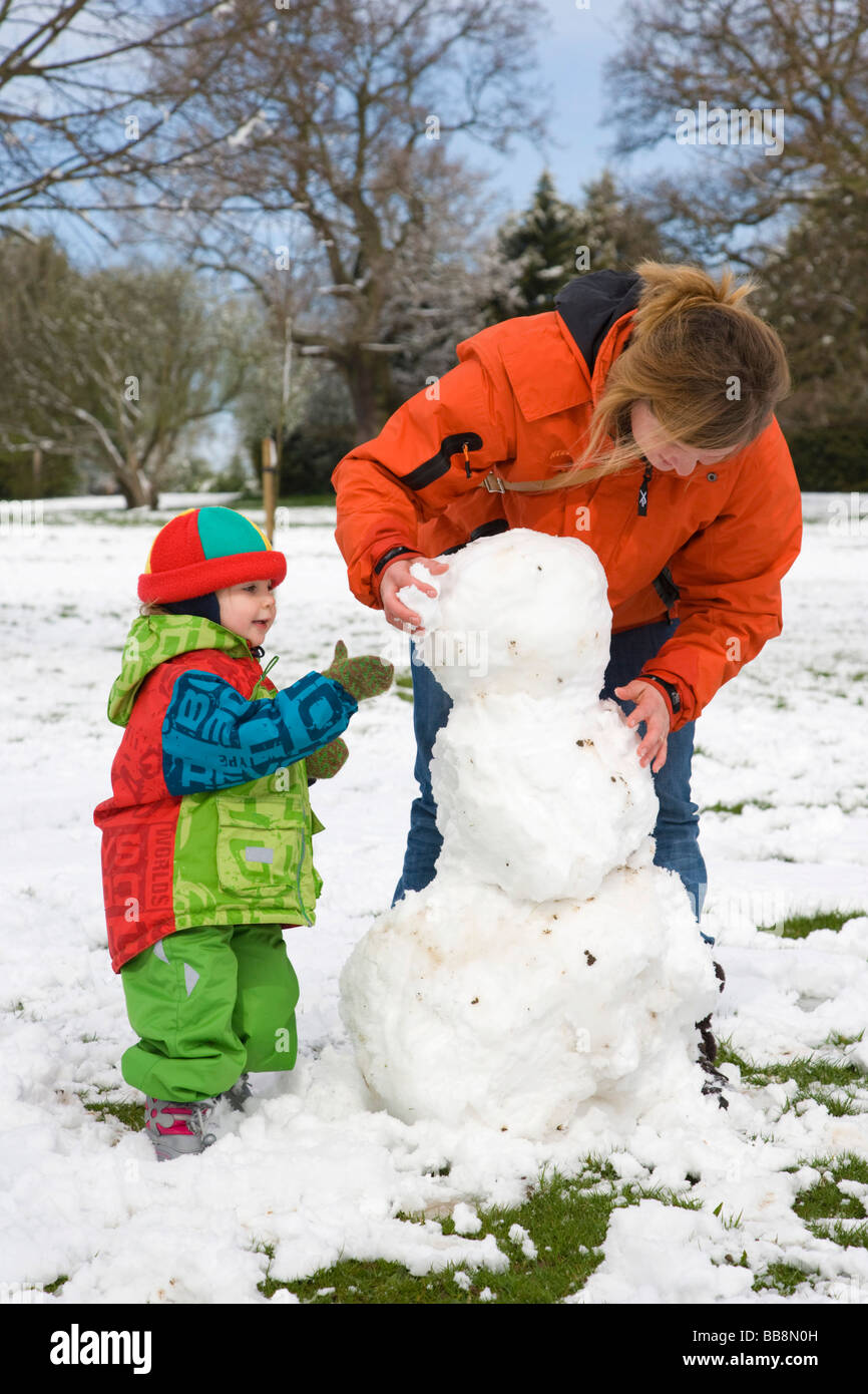 Kids Building Snowman High Resolution Stock Photography and Images - Alamy