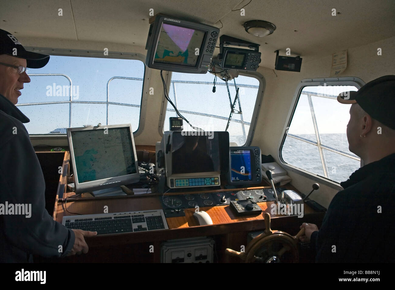 Steersman on command bridge with navigational instruments Kattegat Sea ...