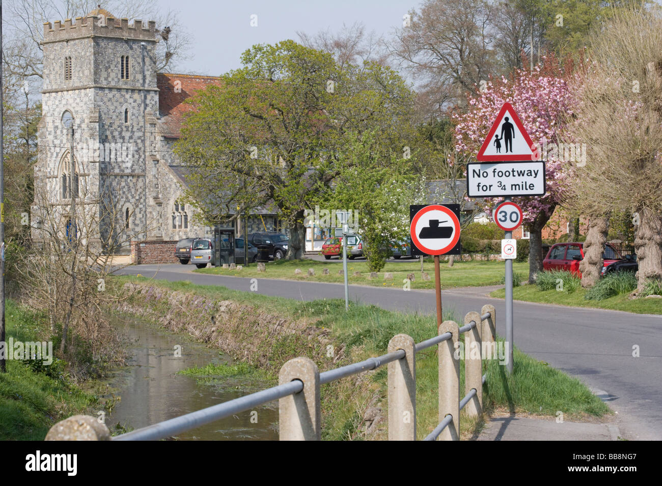 Traffic signs against All Saints Church, Chitterne, Wiltshire, England ...