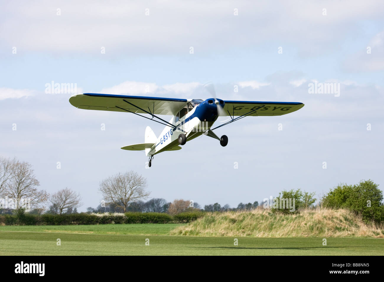 Piper PA-12 Super Cruiser G-BSYG climbing steeply after take-off at ...