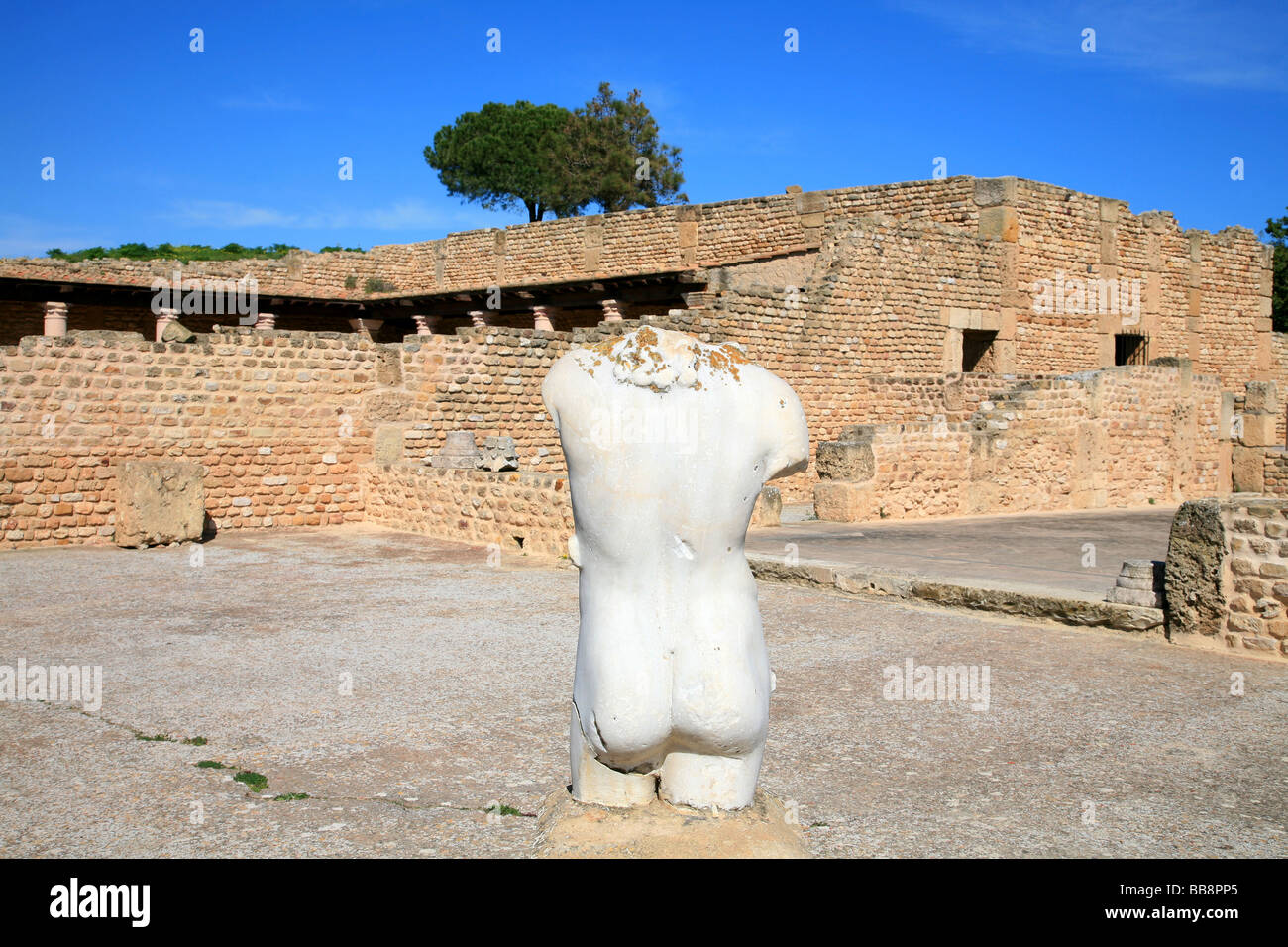 A statue of a male torso at the entrance of a villa in Carthage ...