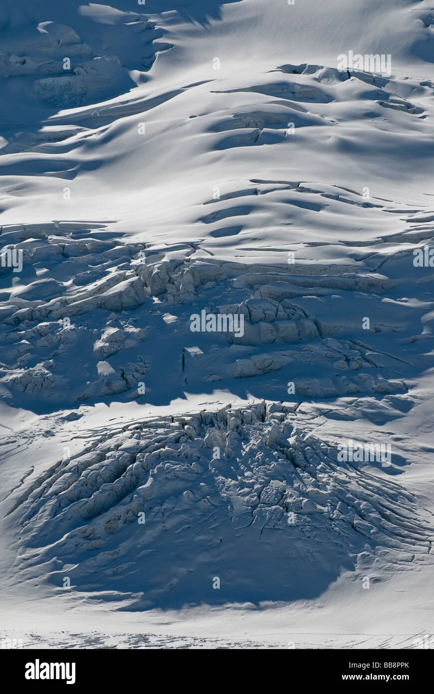 Glaciated mountain slope of the Piz Palue, 3900 m above sea level ...