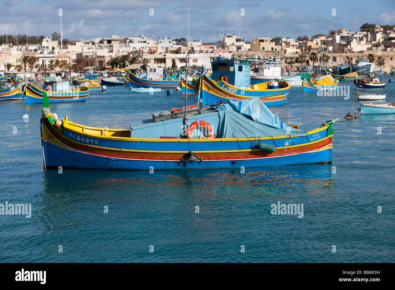 Traditional Maltese fishing boats, called Luzzu, port of Marsaxlokk ...