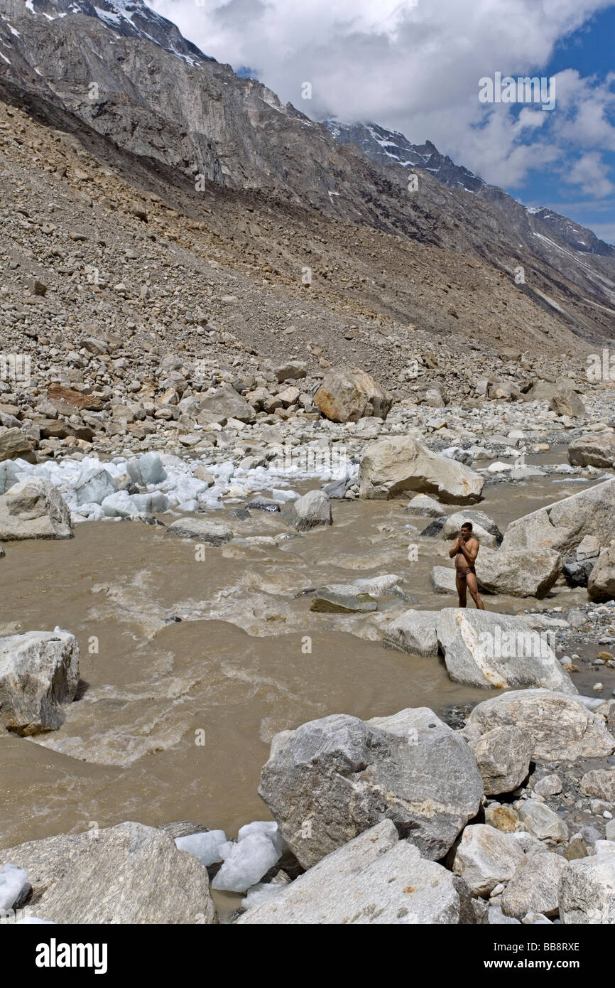 Devote praying at Gaumukh Glacier.The source of Ganges river. Gangotri ...