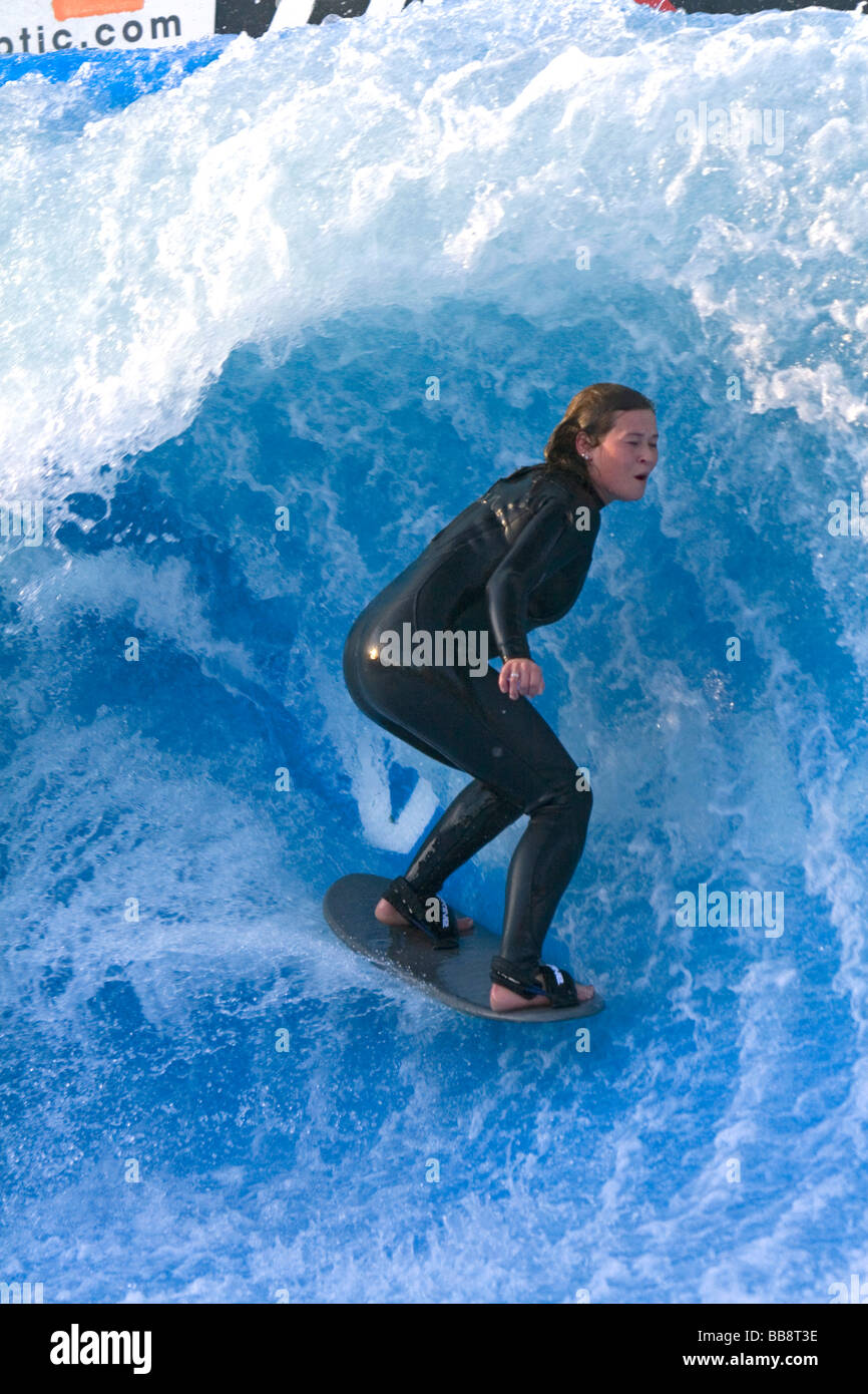 Woman surfing on a man made wave machine at Mission Beach San Diego ...